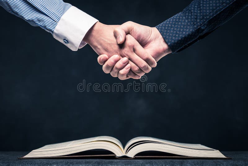 Shake hands on open books stock image. Image of shine - 94286079