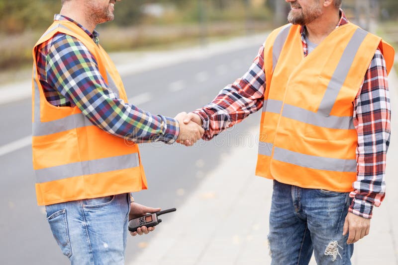 Shaking Hand on the Road Construction Field Stock Photo - Image of ...