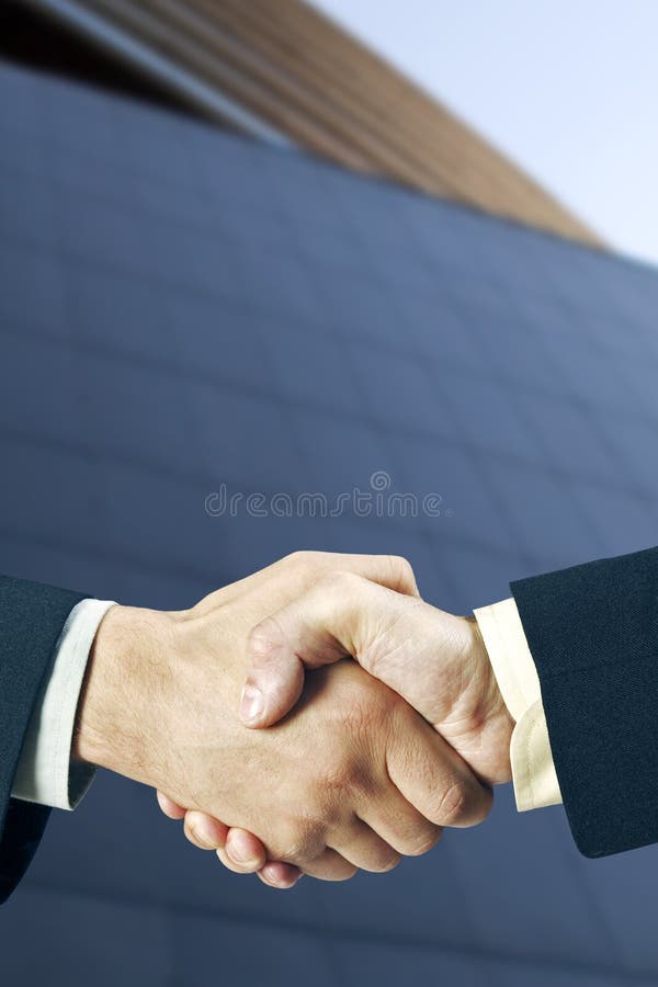 Shaking Hands in Front of a Building Stock Image - Image of grip ...