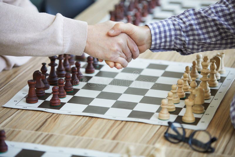 Shaking hands before game stock photo. Image of class - 150001556