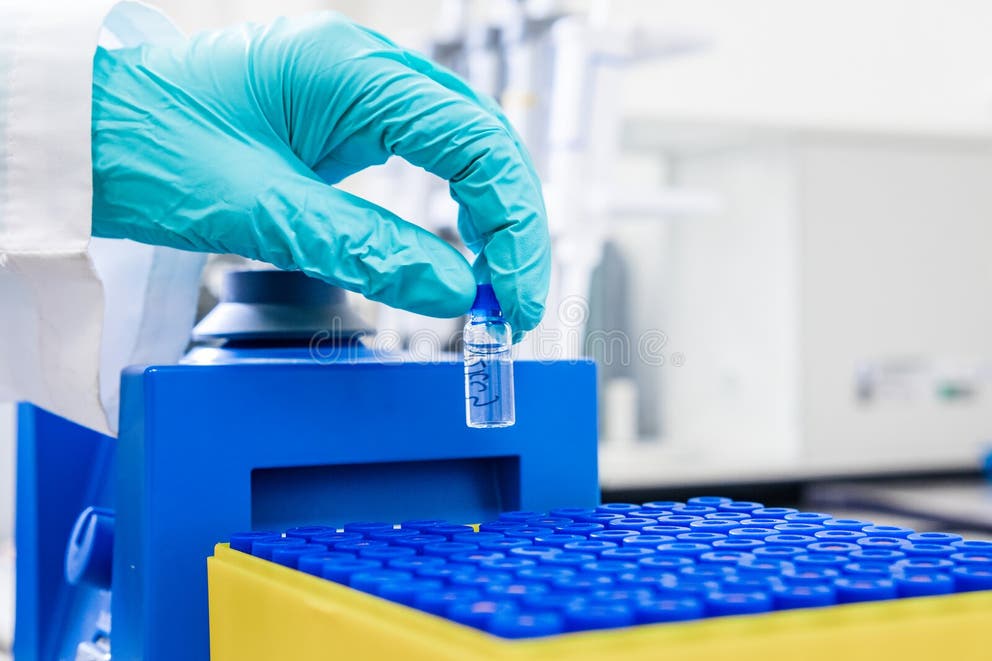 Shaking Samples with a Vortex Mixer, a Chemist Prepares Them for HPLC ...
