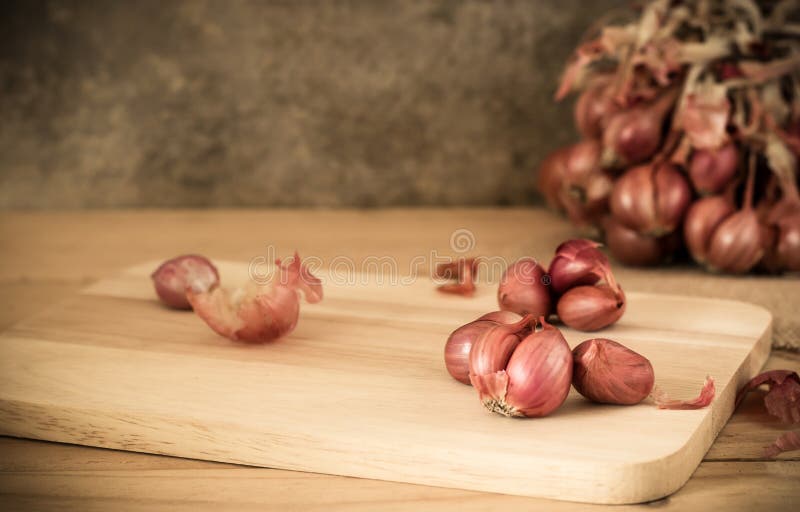 The Shallots in Bowl on Old Wooden Table with Old Wallpaper and Stock ...