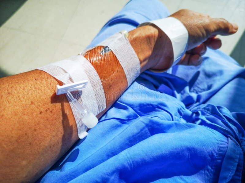 Shallow Depth of Field Shot of Iv Drip in Patient`s Hand, Infusion Drip ... Shallow Depth of Field Shot of Iv Drip in Patient`s Hand, Infusion Drip ...