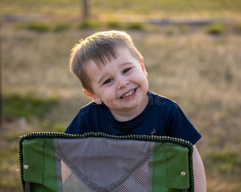 Shallow Focus Shot of a Happy Little Blond Boy Stock Photo - Image of ...