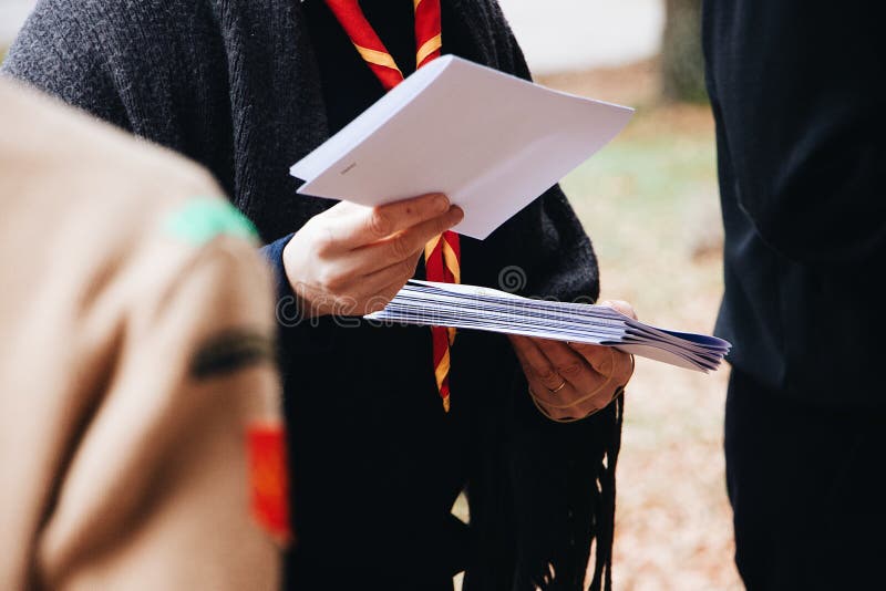 Shallow Focus Shot of a Scout Distributing White Papers Stock Image ...