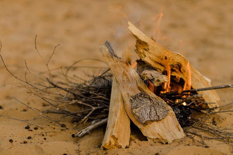 Shallow Focus Shot of a Small Bonfire in the Middle of a Desert for ...