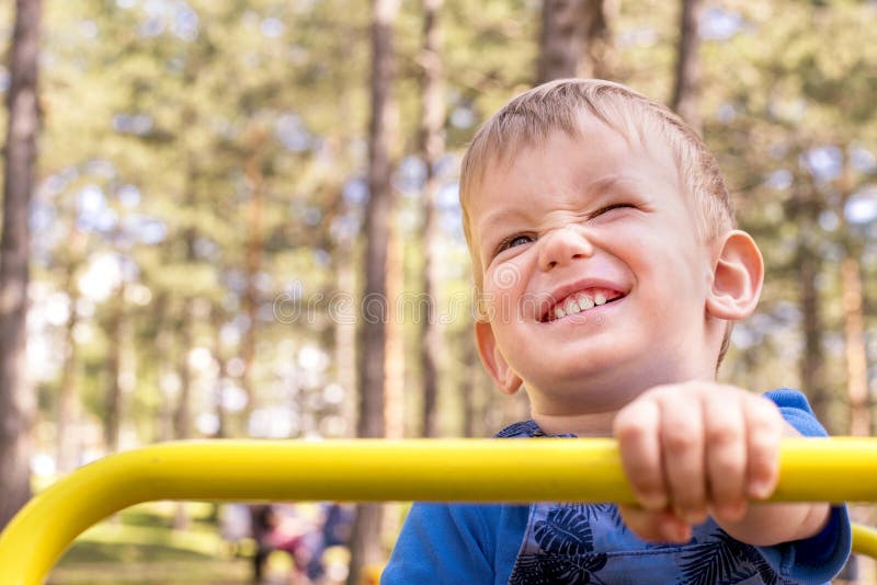 Shallow Focus Shot of a Smiling Kid Having Fun in the Playground Stock ...