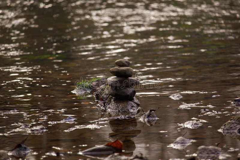 Shallow Focus Shot of a Stack of Balancing Rocks in the Water - Zen ...
