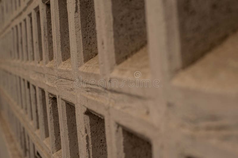 Shallow Focus Shot of a Stone Wall with Square Holes on it Stock Image ...