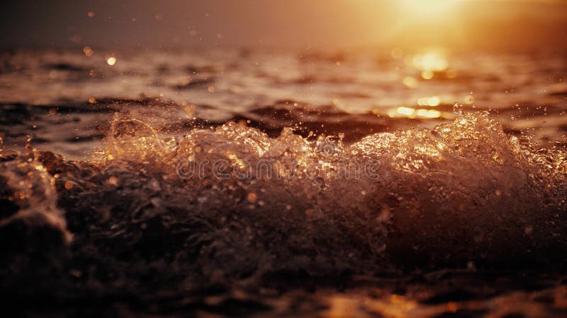 Shallow Focus Shot of Tidal Waves and Sunset at Sea Stock Photo - Image ...