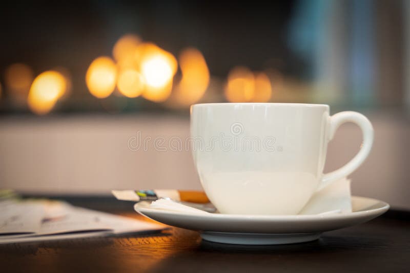 Shallow Focus Shot of a White Coffee Cup with a Blurry Background of ...
