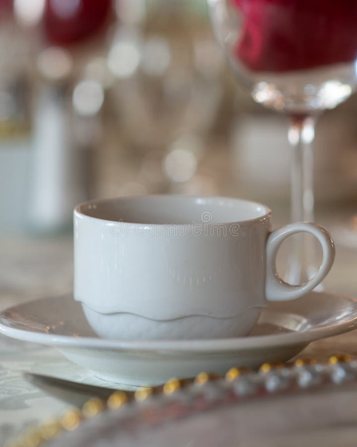 Shallow Focus Shot of a White Coffee Cup with a Saucer As a Part of the ...