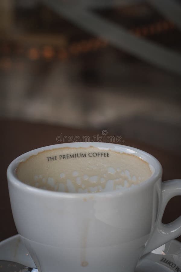 Shallow Focus Shot of a White Coffee Cup with a Text the Premium Coffee ...