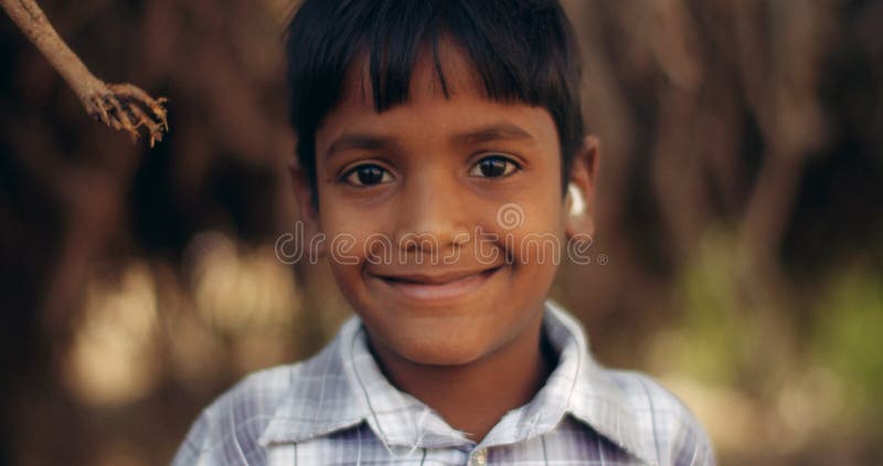 Shallow Focus of a Smiling Indian Boy Outdoors Stock Image - Image of ...