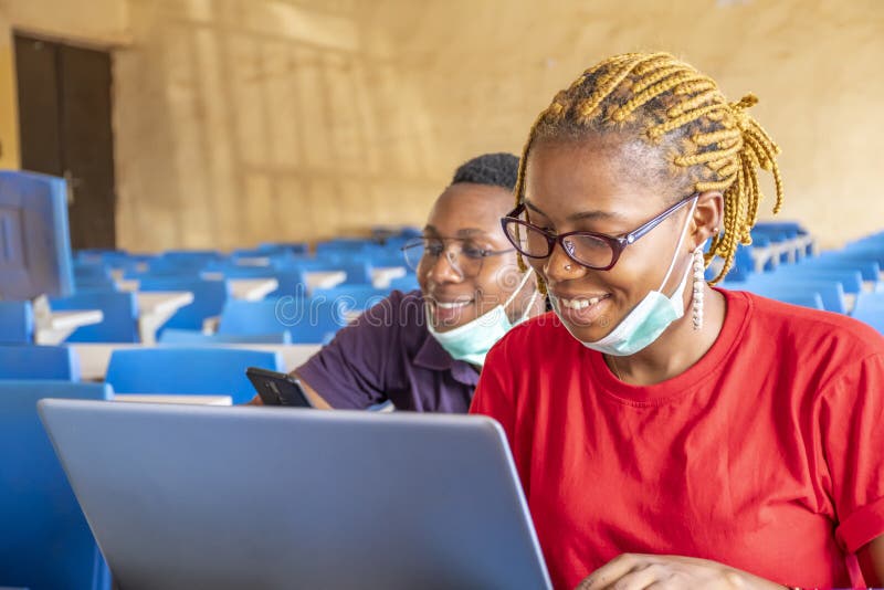 Shallow Focus of Two Young African Students Wearing Facemasks and Using ...