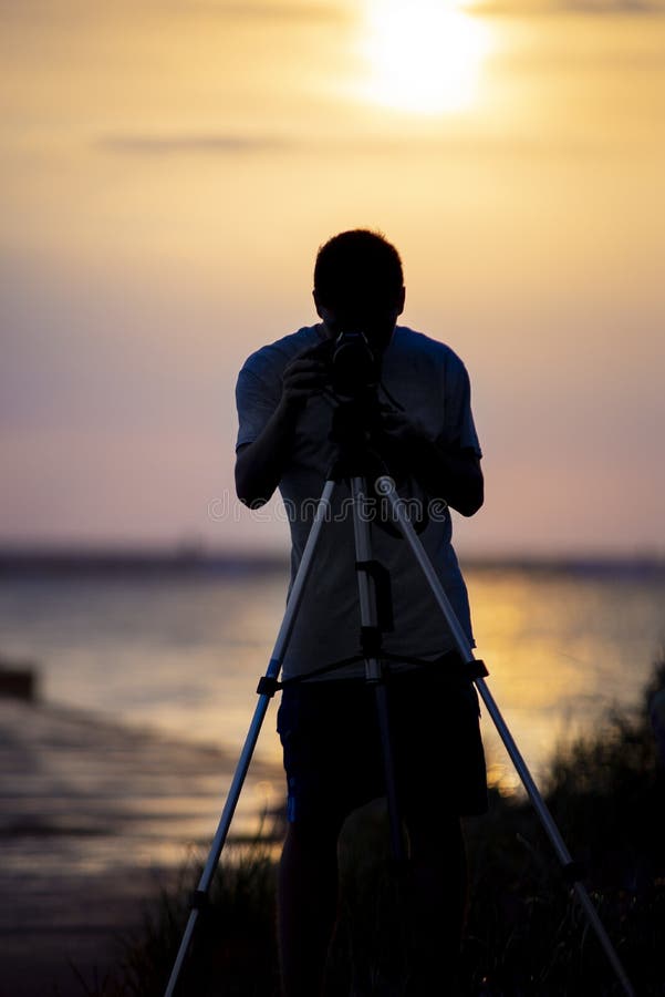 Shallow Focus Vertical Shot of a Person Taking a Photo Editorial Image ...