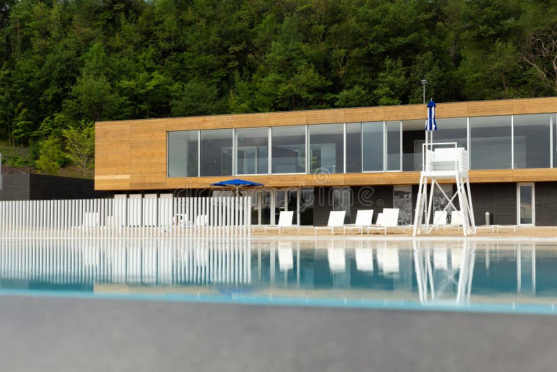 Shallow Infinity Pool with Modern Pavilion in the Background in a St ...