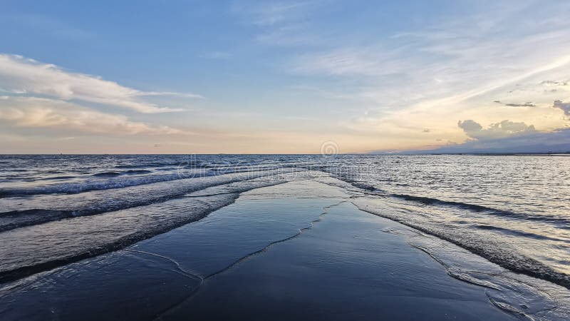 Shallow sea waves converge stock photo. Image of snow - 188999872