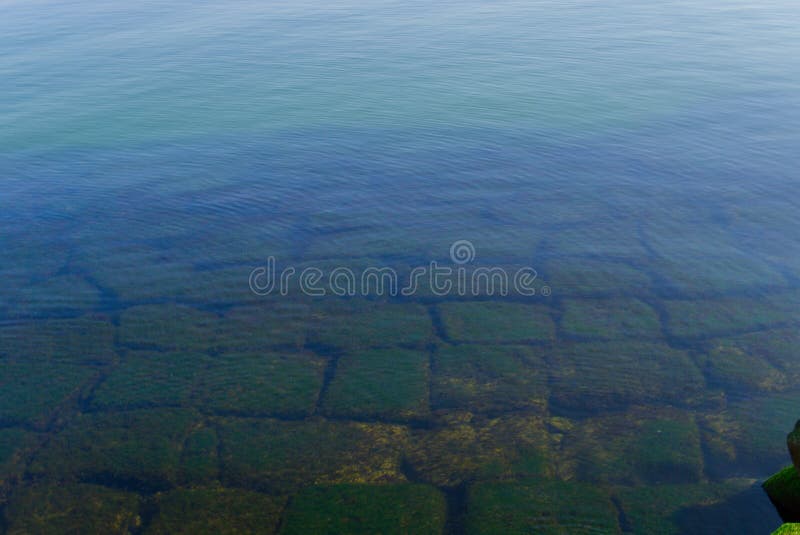 Shallow Seabed with Stacked Stones To Reinforce the Shore Stock Image ...