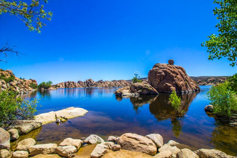 Shallow Shoreline of Lake with Unique Rock Formations Stock Photo ...