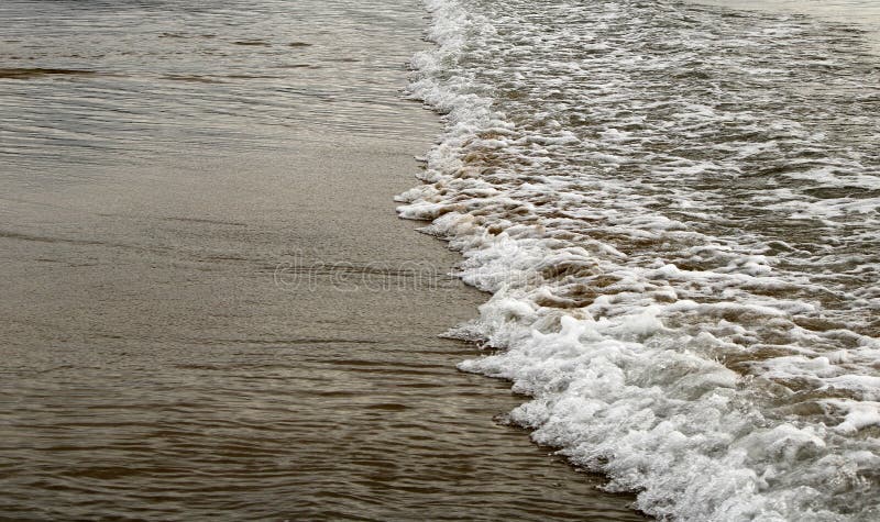 A Shallow Wave on Sandy Beach Stock Photo - Image of coastline, sand ...