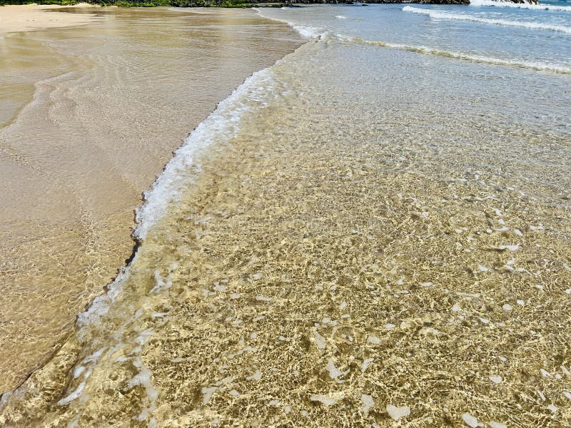 Shallow Waves of Crystal Clear Water Rolling on a Fine Sandy Beach ...