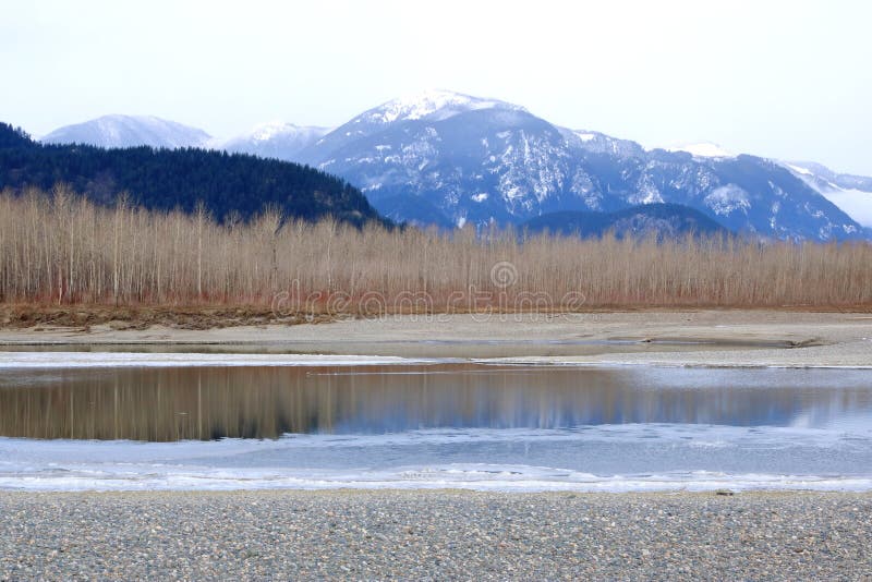 Shallow Winter Riverbed and Mountains Stock Photo - Image of natural ...