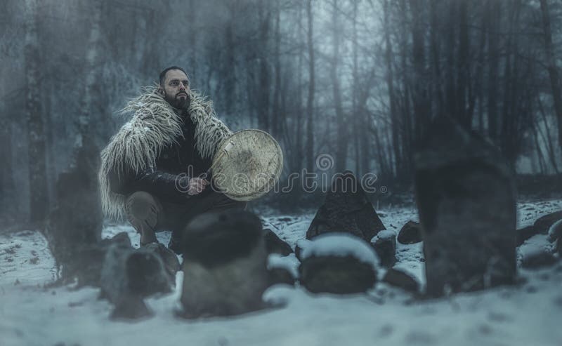 Shamanic Man Playing on Shaman Frame Drum in the Nature. Stock Photo ...