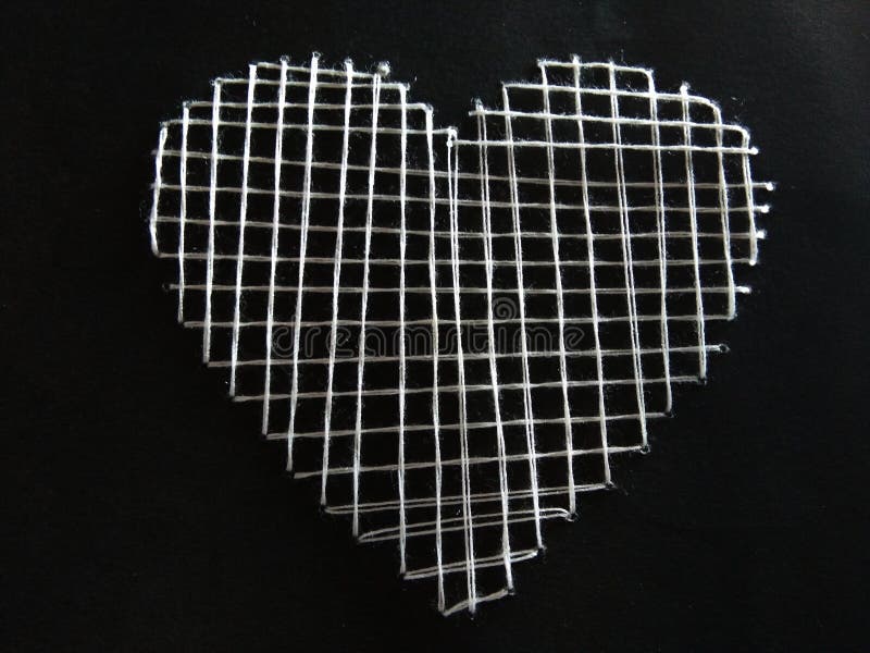 The Shape of the Heart Made of Thread on Black Paper Stock Image ...