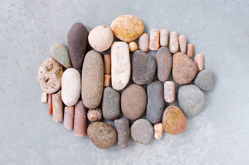 Shape of Various Stones on the Textured Grey Background Stock Image ...