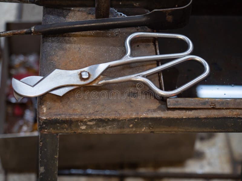 Diamond Shear Tool on Wet Steel Table in Glass Blowing Art Studio Stock ...