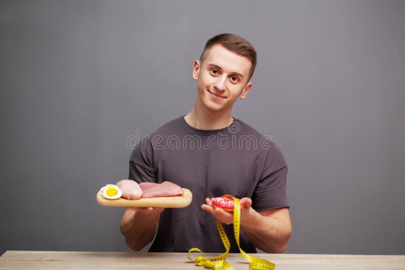 Shaped and Healthy Man Holding a Fresh Meal Board with Meat Stock Image ...