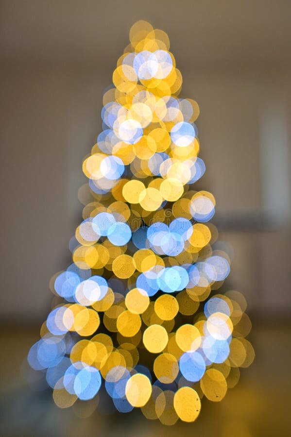 Shaped Light Bokeh on a Christmas Tree Inside Oh House Stock Image - Image of light, gold: 262625455