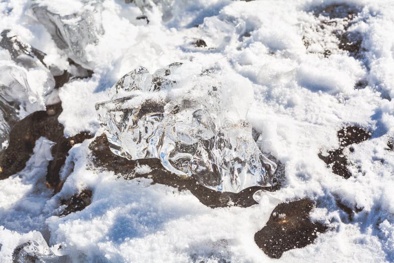 Shapeless Piece of Ice on Rock Stock Image - Image of melted, abstract ...