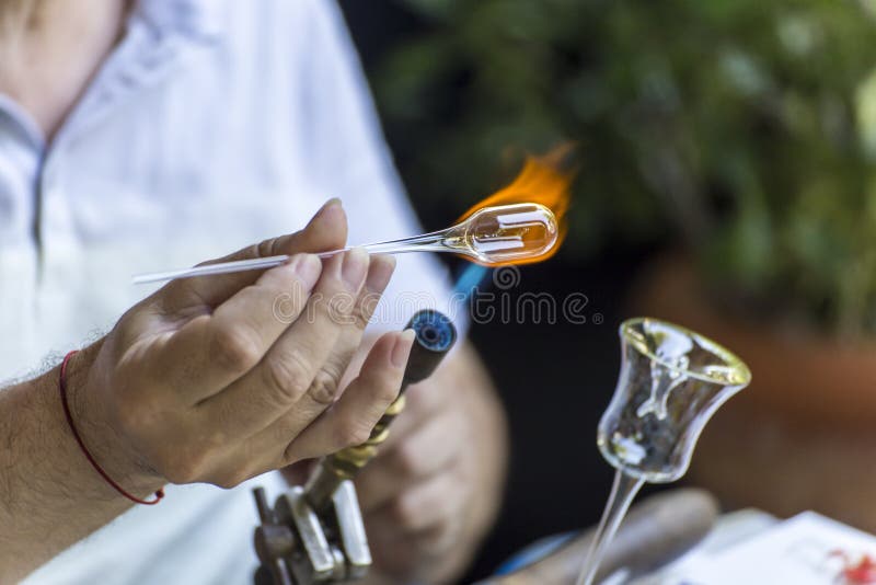 Shaping a piece of glass stock image. Image of forming - 75490779