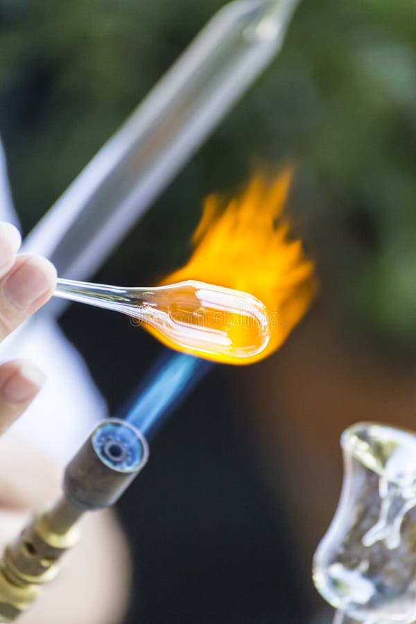 Shaping a piece of glass stock image. Image of forming - 75490779