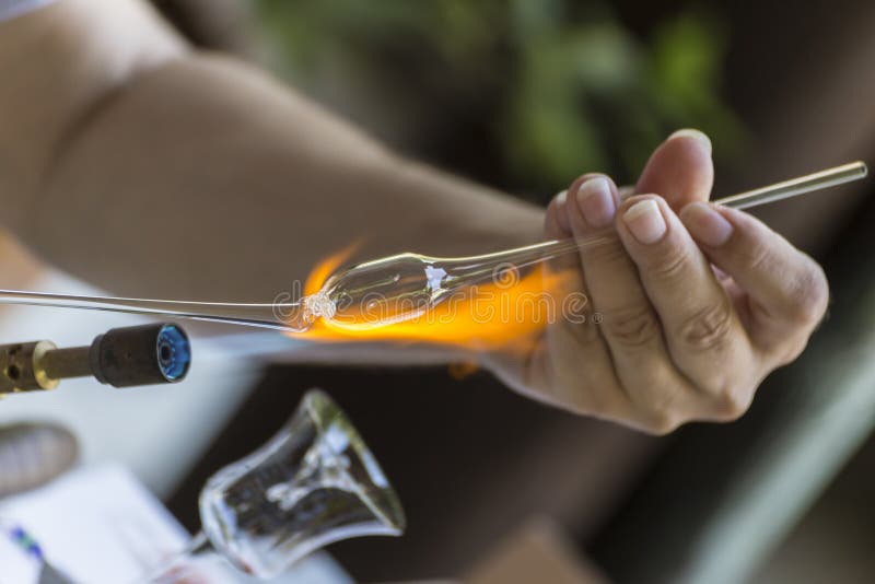 Shaping a piece of glass stock image. Image of production - 75491699