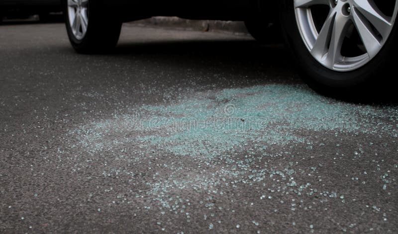 Shards of Broken Auto Glass Near the Car Wheel Stock Image - Image of ...