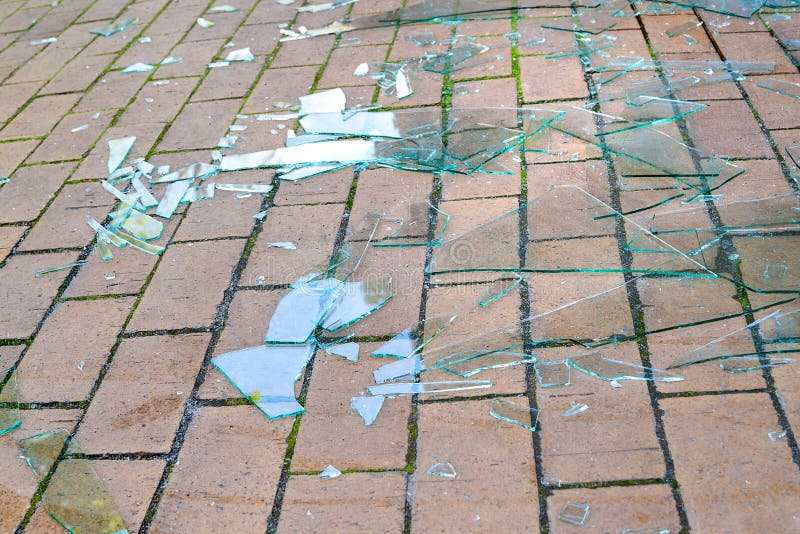 Shards of Broken Glass. Pieces of Broken Glass on the Paving Stones ...