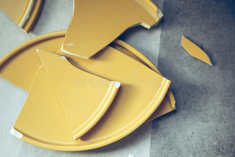 Shards of a Broken Yellow Dish Stock Image - Image of break, clay ...