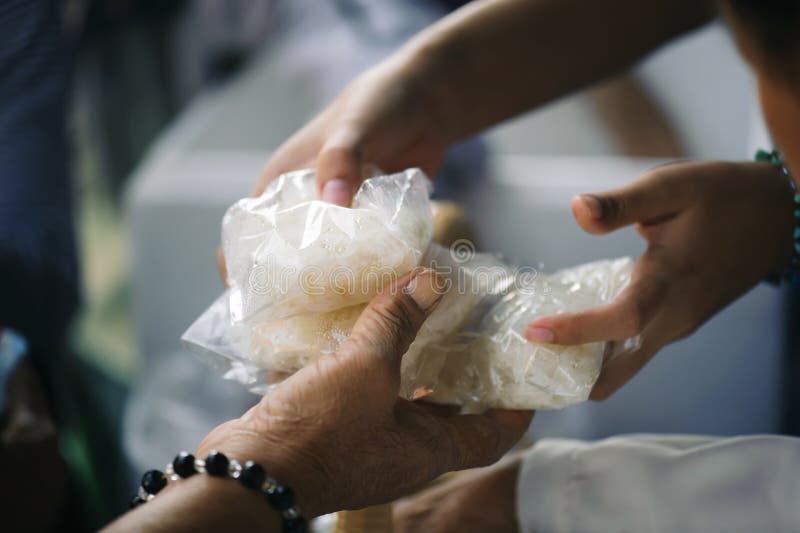 Share Food from Hand To Hand with Donations Stock Photo - Image of ...
