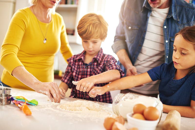 They Share a Love for Baking. a Family Baking Together at Home. Stock ...