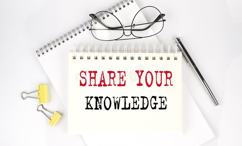 SHARE YOUR KNOWLEDGE Text on the Notebook with Pen,clips and Glasses ...