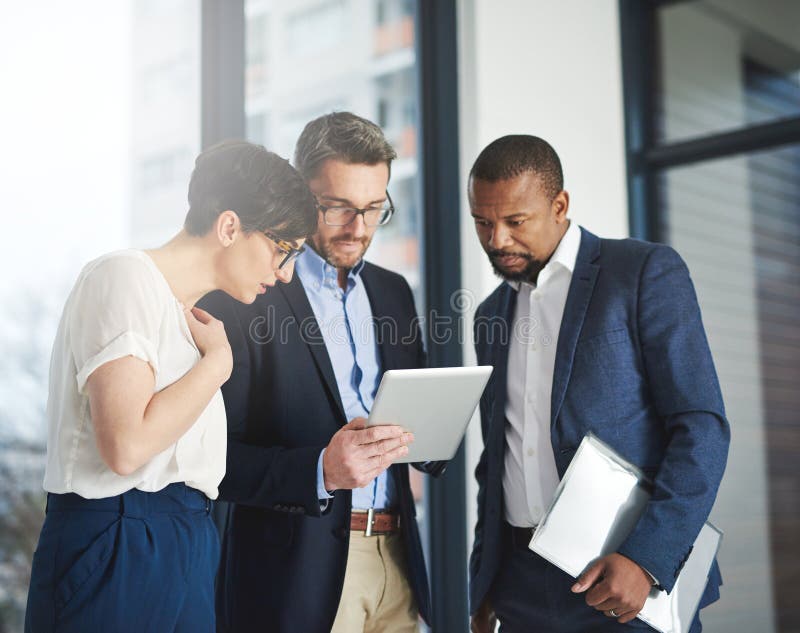 Shared Knowledge Benefits Everyone in Business. Shot of a Team of ...