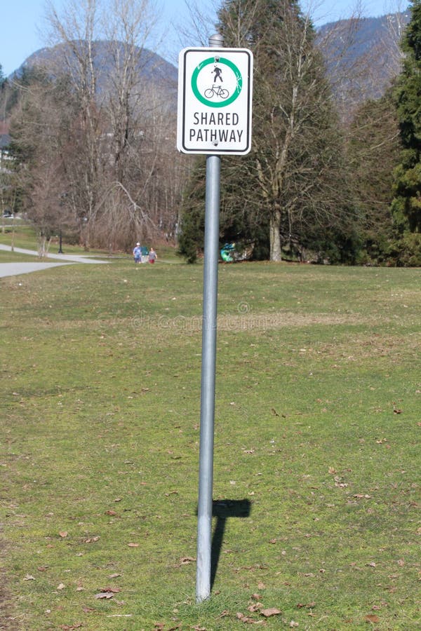 A shared pathway sign stock photo. Image of green, tree - 112717172