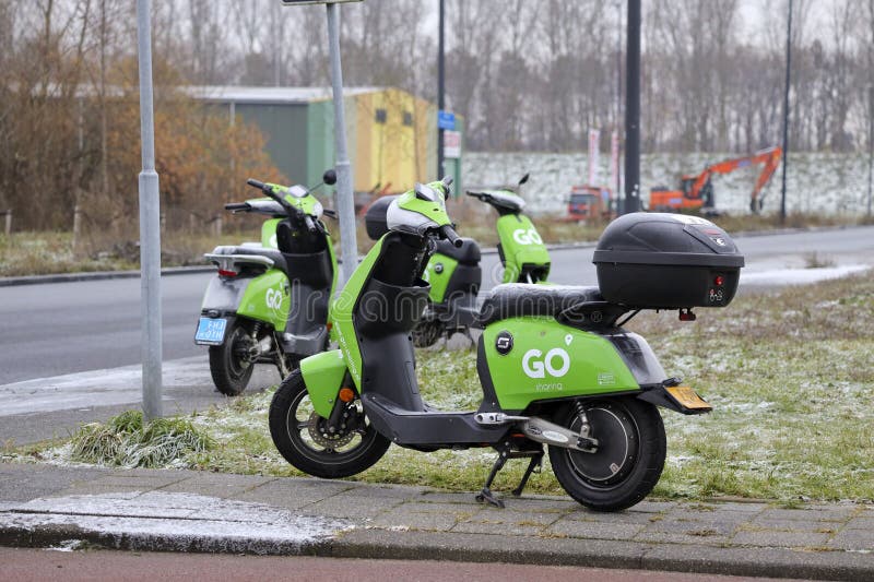 Shared Scooters of GO Parked on Pavement in the Winter Editorial ...
