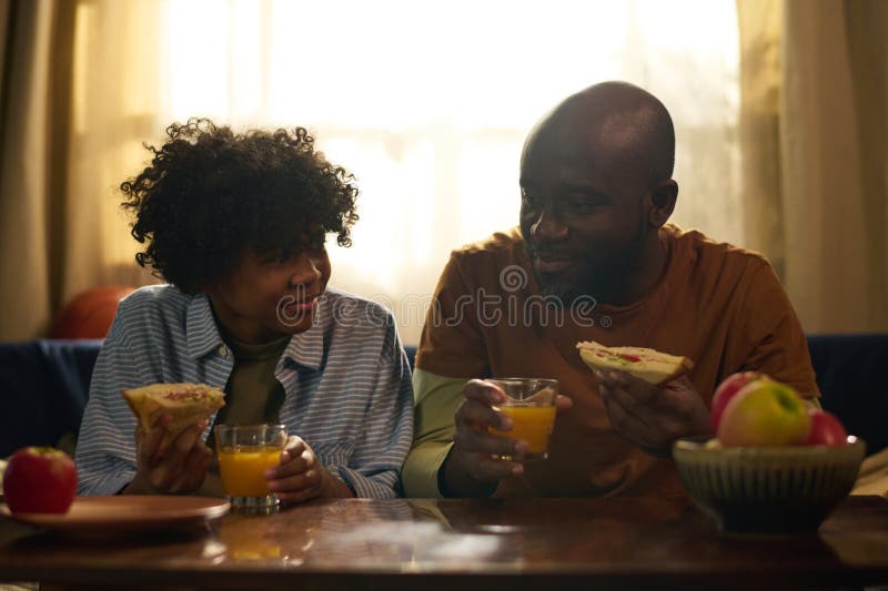 Sharing Breakfast Conversations in Cozy Kitchen Setting Stock Photo ...