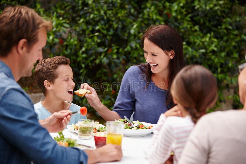 Sharing is Caring. a Happy Multi-generational Family Having a Meal ...