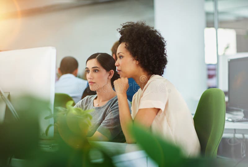 Sharing Design Ideas. Two Young Designers Talking Together while ...