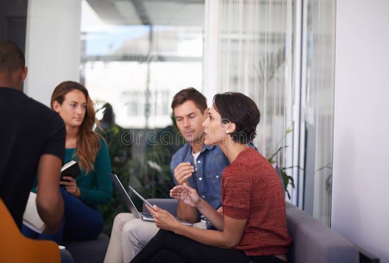 Sharing Her Thoughts with the Group. a Team of Young Professionals ...